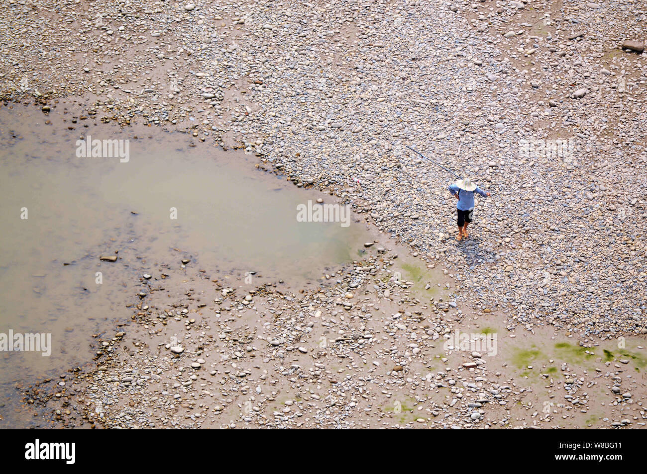 View of the exposed riverbed as water levels dropped on the ...