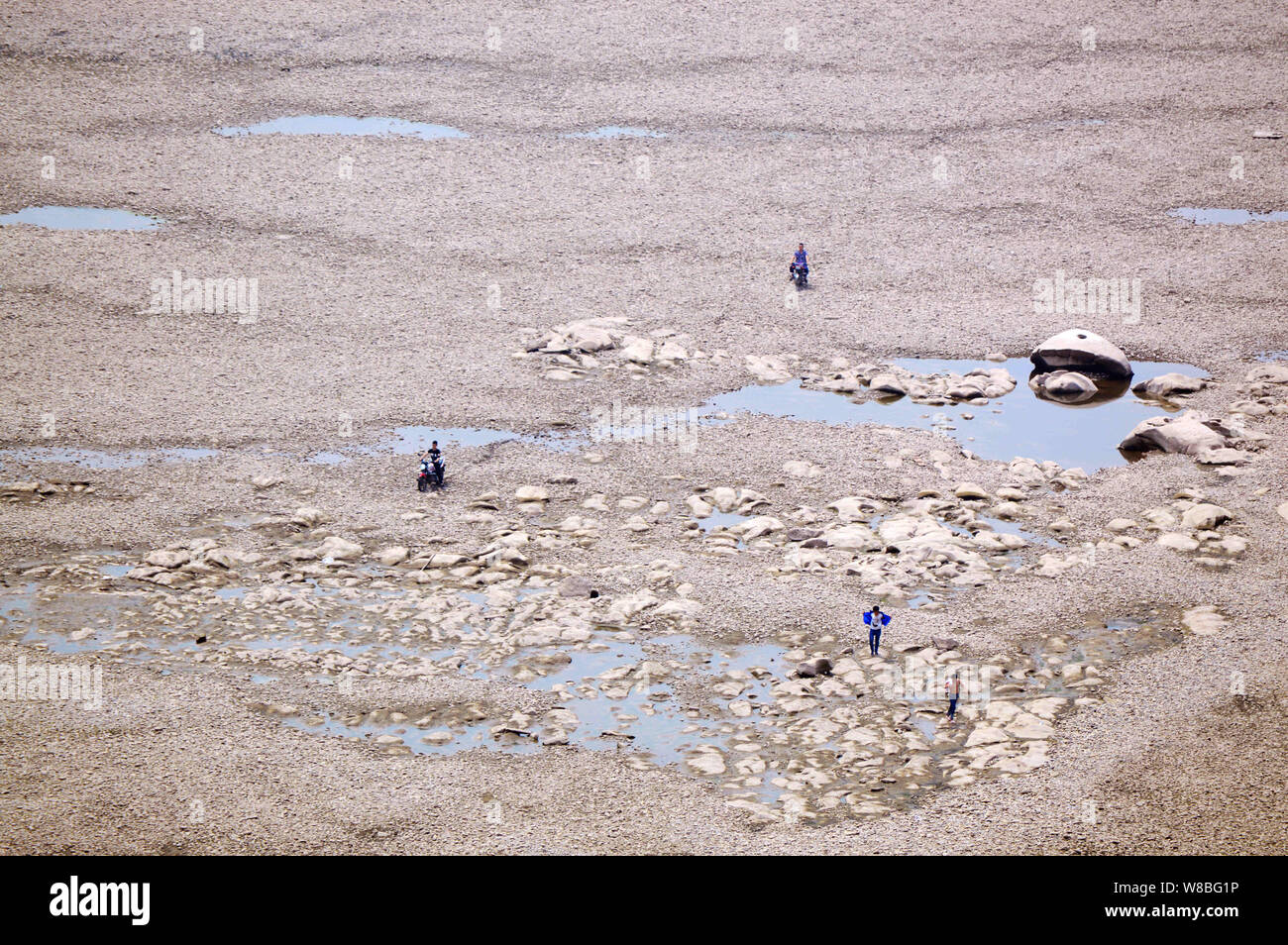 View of the exposed riverbed as water levels dropped on the ...