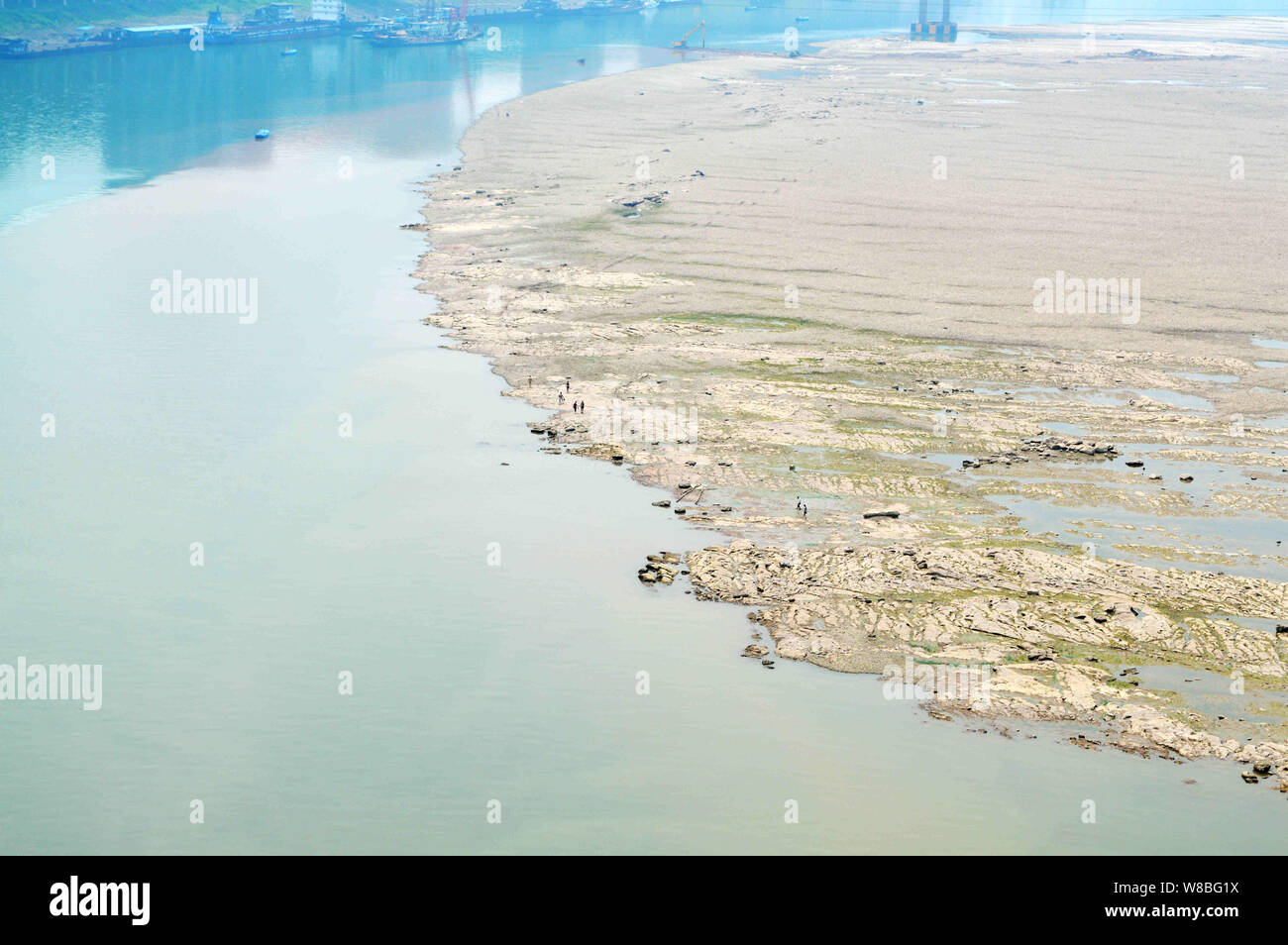 View of the exposed riverbed as water levels dropped on the ...