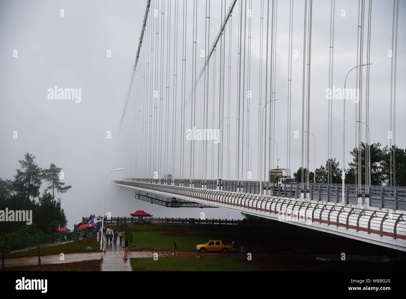 View of the Longjiang Grand Bridge enveloped by mist and cloud on the ...