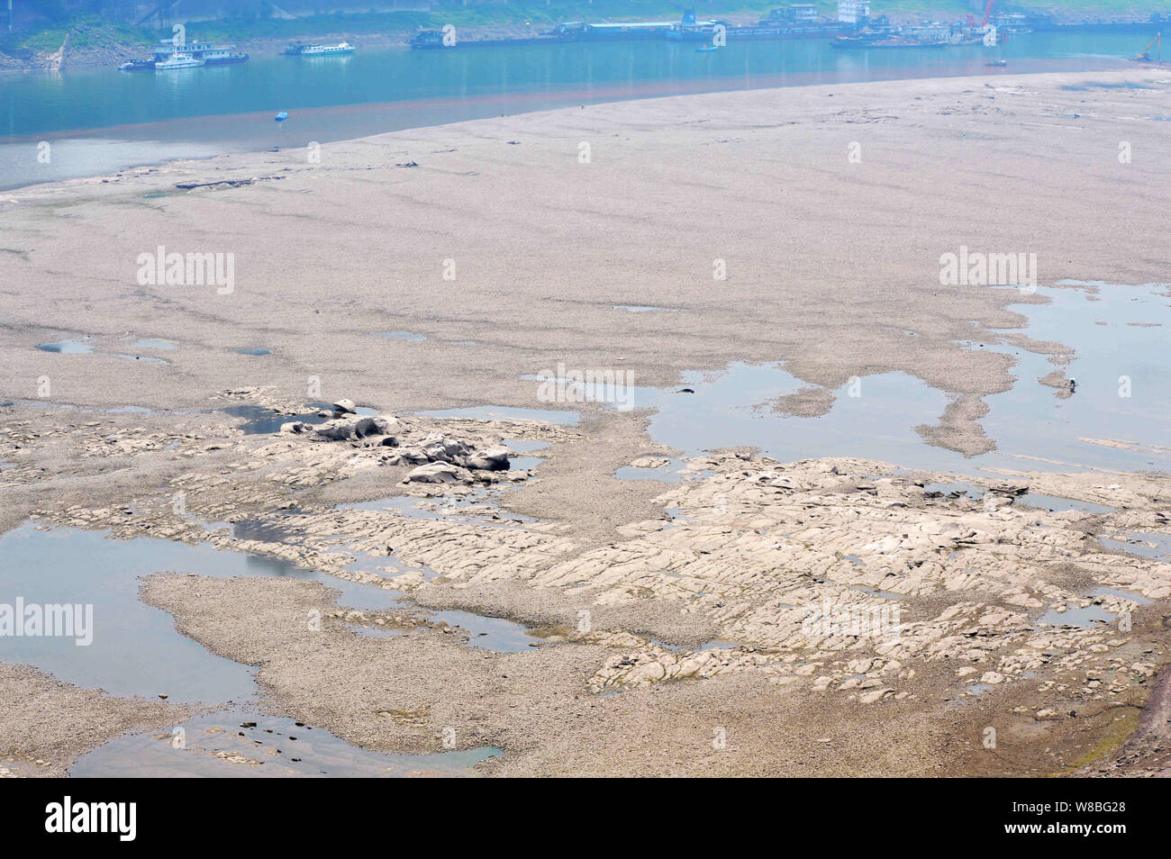 View of the exposed riverbed as water levels dropped on the ...