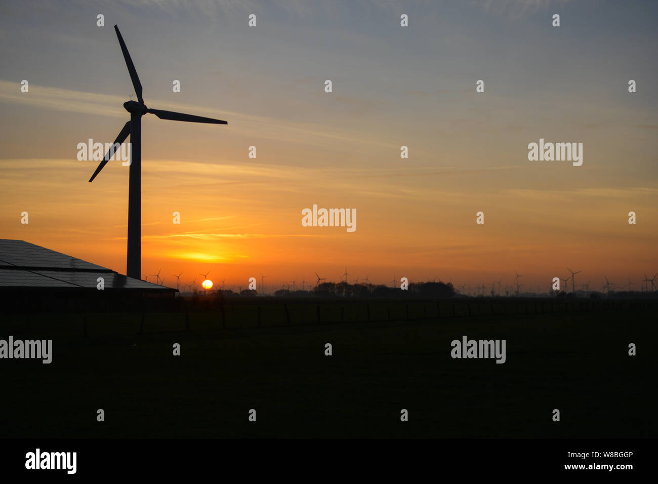 a wonderful sunrise over windmills Stock Photo - Alamy