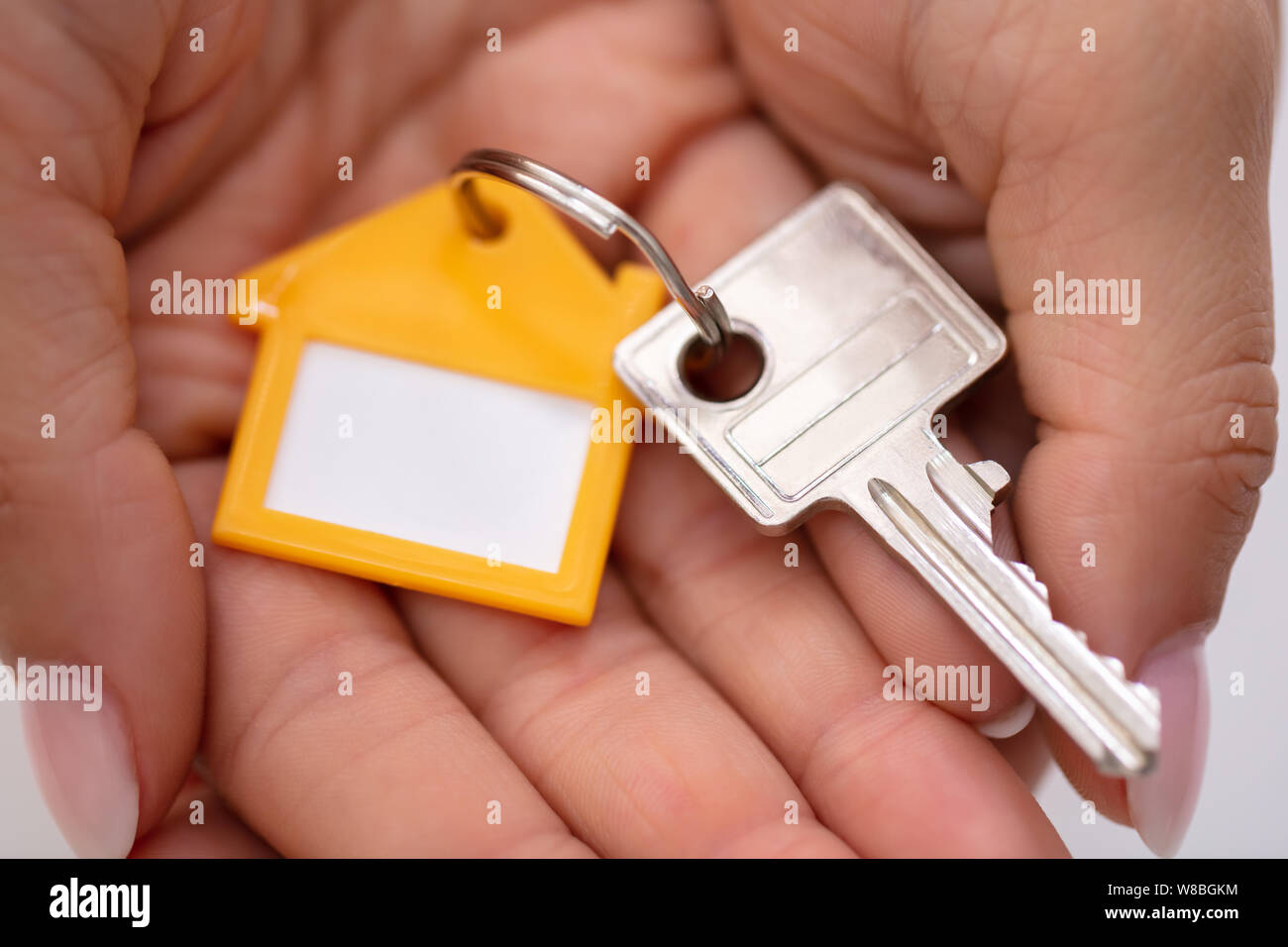 Hand holding model house hi-res stock photography and images - Alamy