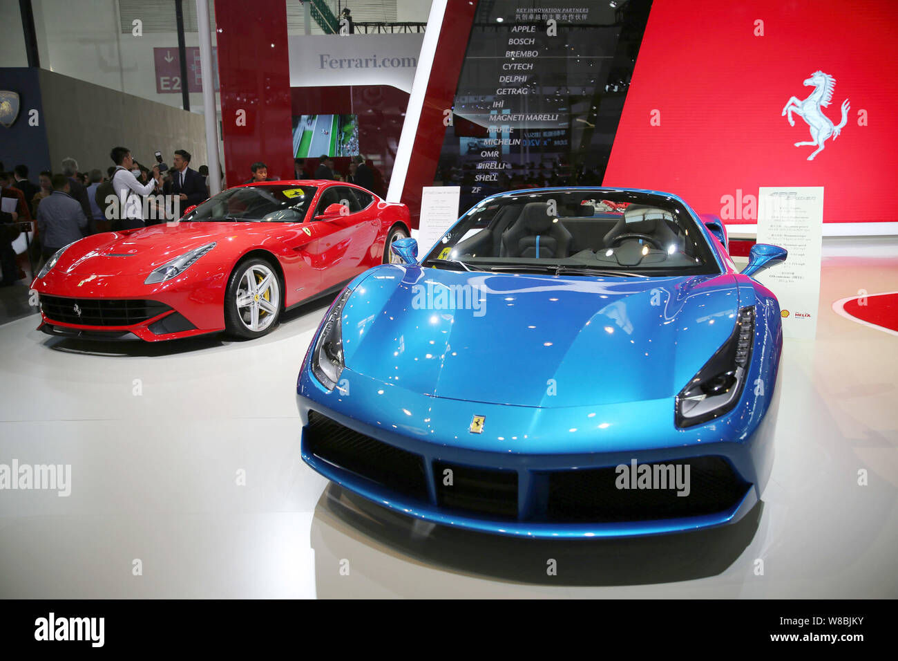 Ferrari 488 GTB, front, and F12 Berlinetta sports cars are on display ...