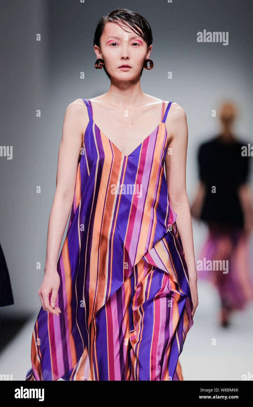 A model displays a new creation at the MAKEMAKE fashion show during the ...