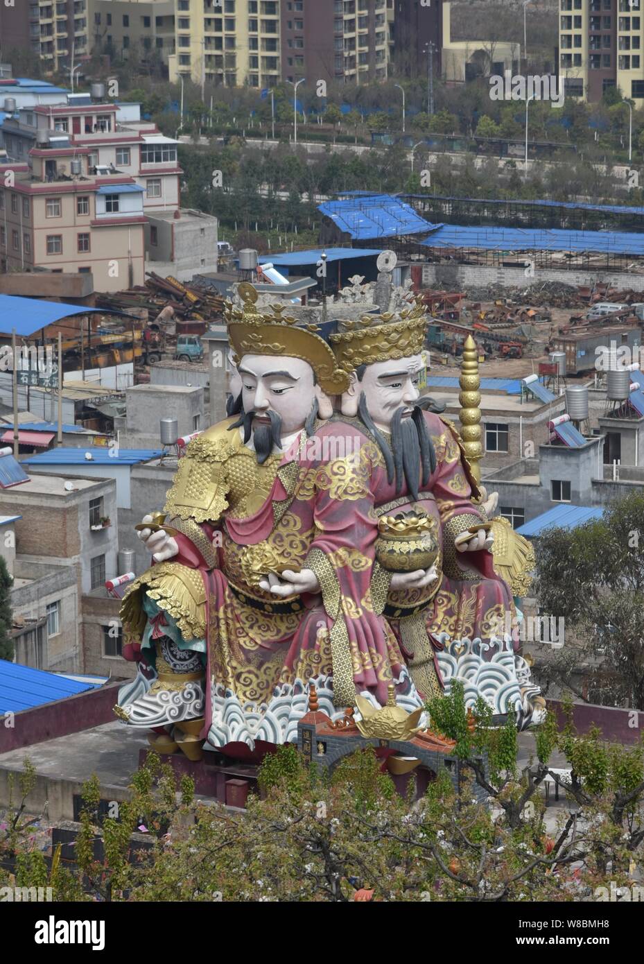 View of giant sculptures on the rooftop of a building in Kunming city ...