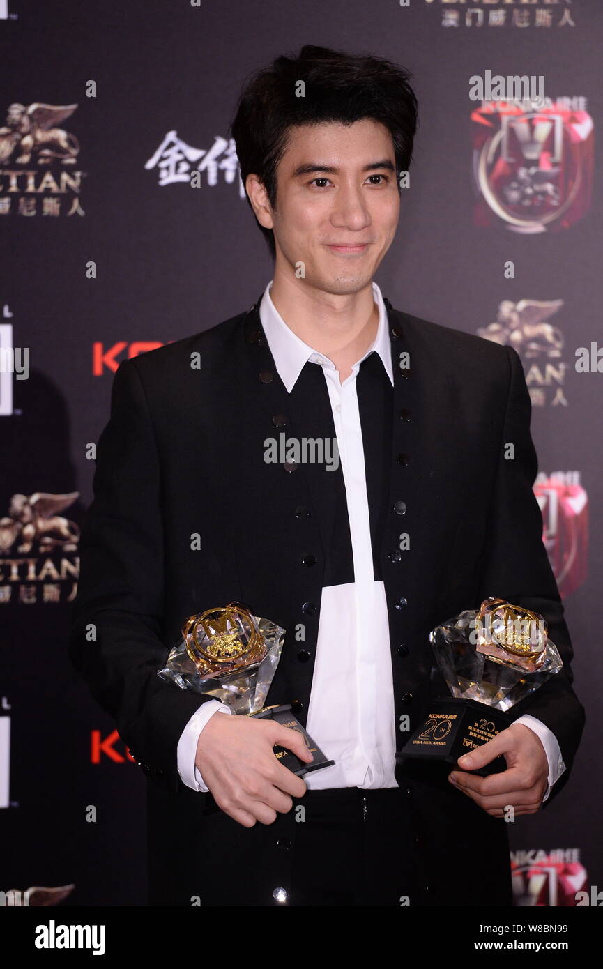 Taiwanese singer Leehom Wang poses with his trophies after the 20th ... Taiwanese singer Leehom Wang poses with his trophies after the 20th ...