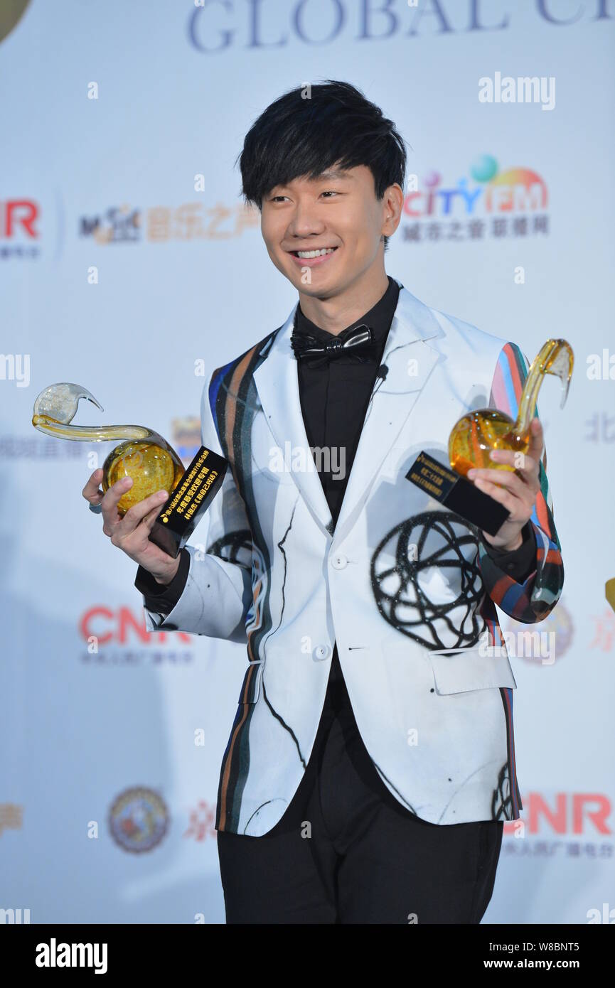 Singaporean singer JJ Lin poses with the trophies during the award ...