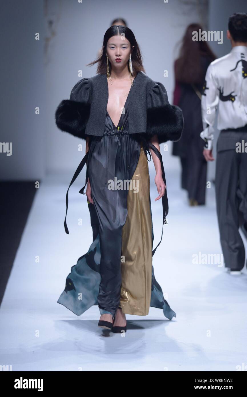 A model displays a new creation at a fashion show of Woolmark Gold X ...