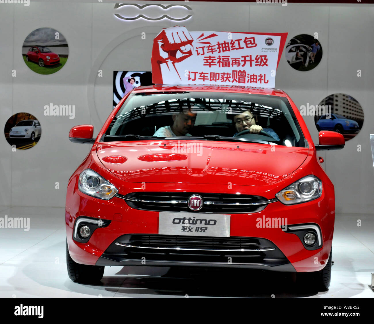 --FILE--Visitors try out a Fiat Ottimo of GAC Fiat Chrysler, a joint ...
