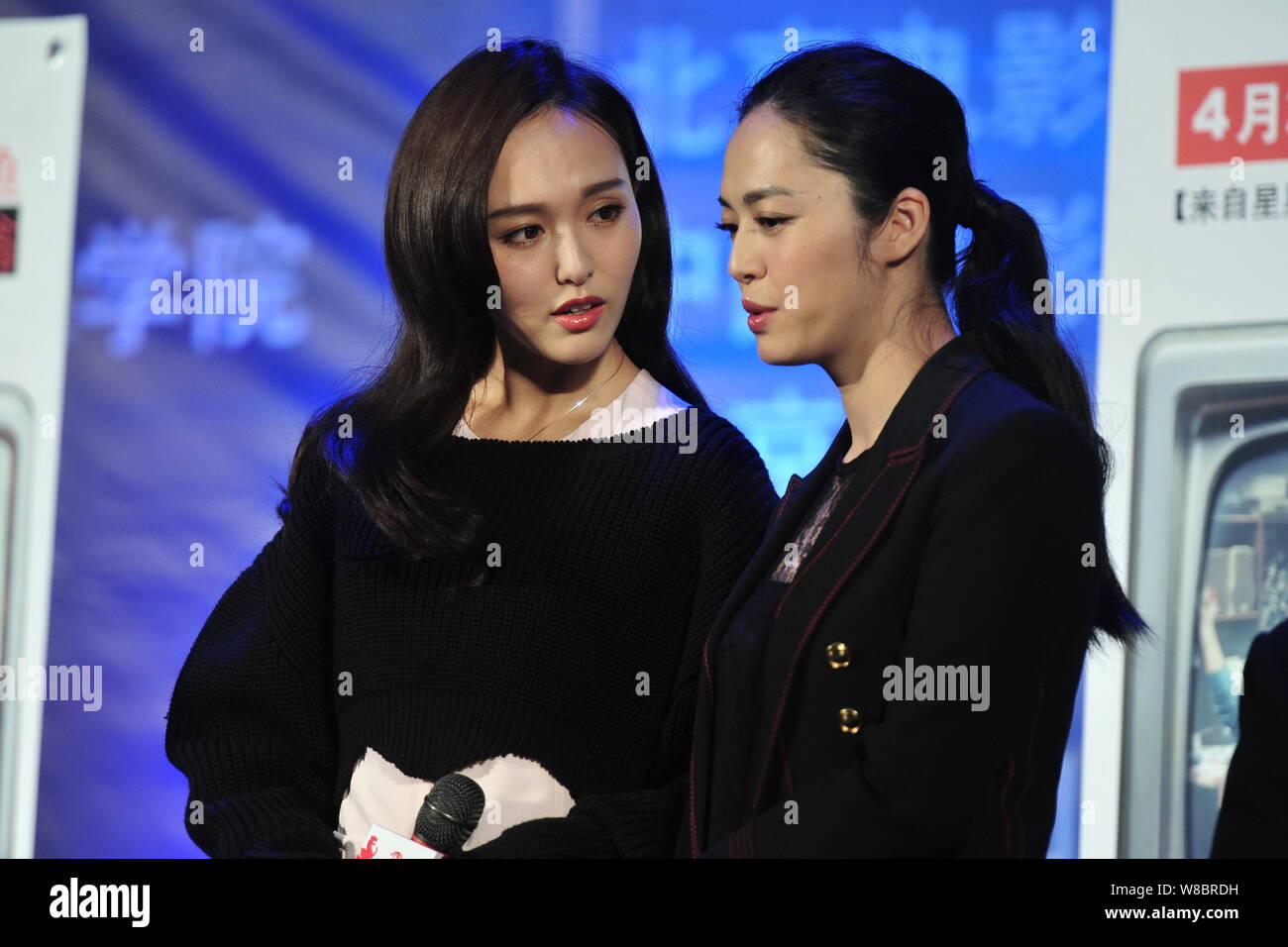 Chinese actresses Yao Chen, right, and Tang Yan talk at the opening ceremony for the 23rd ...