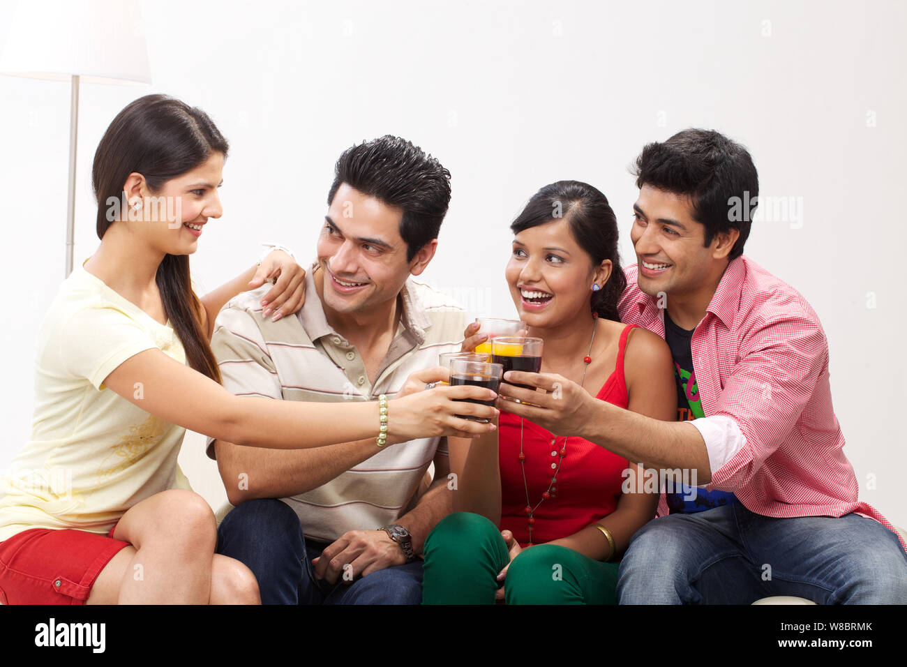 Friends toasting drinks home hi-res stock photography and images - Alamy