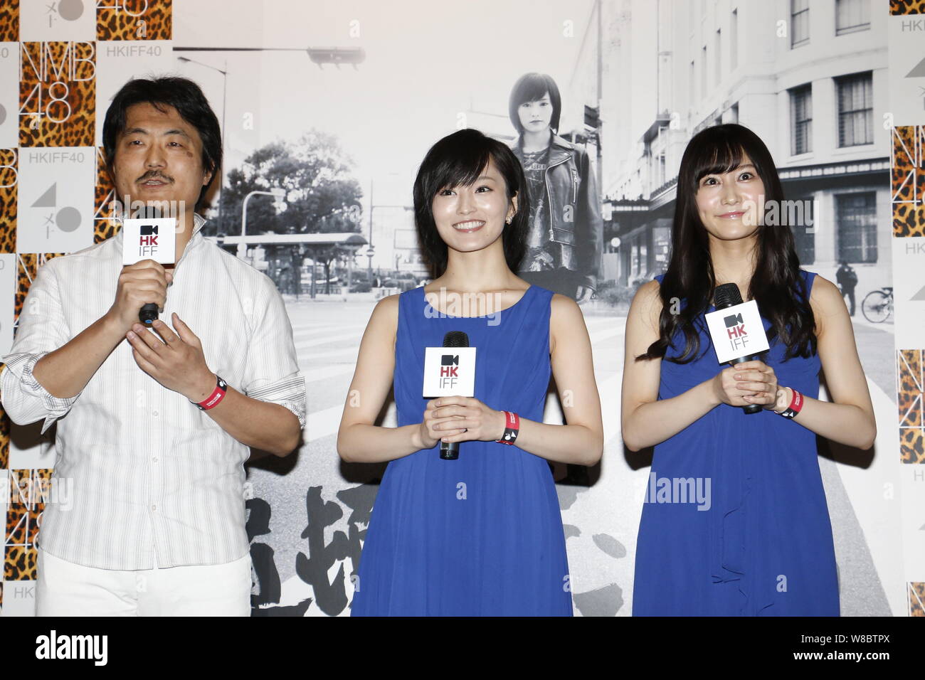 Yamamoto Sayaka, center, and Yagura Fuuko, right, of Japanese girl group NMB48 pose at a ...