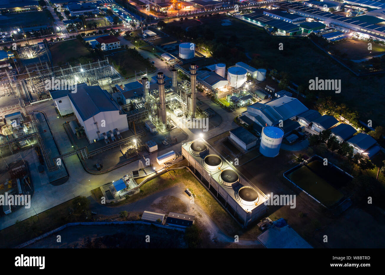 Aerial view night light oil terminal is industrial facility for storage ...