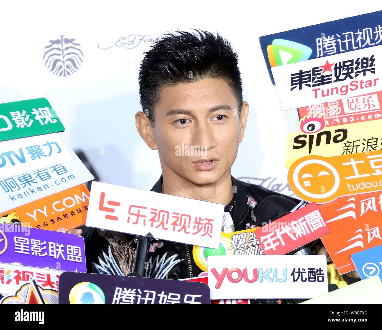 Taiwanese actor Nicky Wu is interviewed as he arrives for a fashion ...