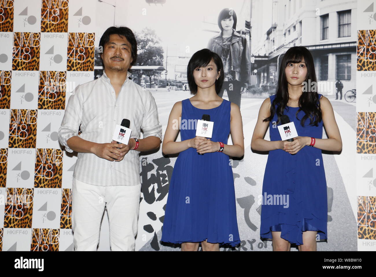 Yamamoto Sayaka, center, and Yagura Fuuko, right, of Japanese girl group NMB48 pose at a ...