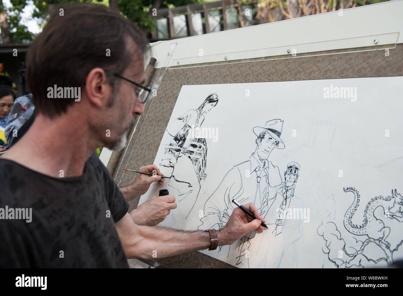 A foreign cartoonist draws pictures showing their impressions of ...
