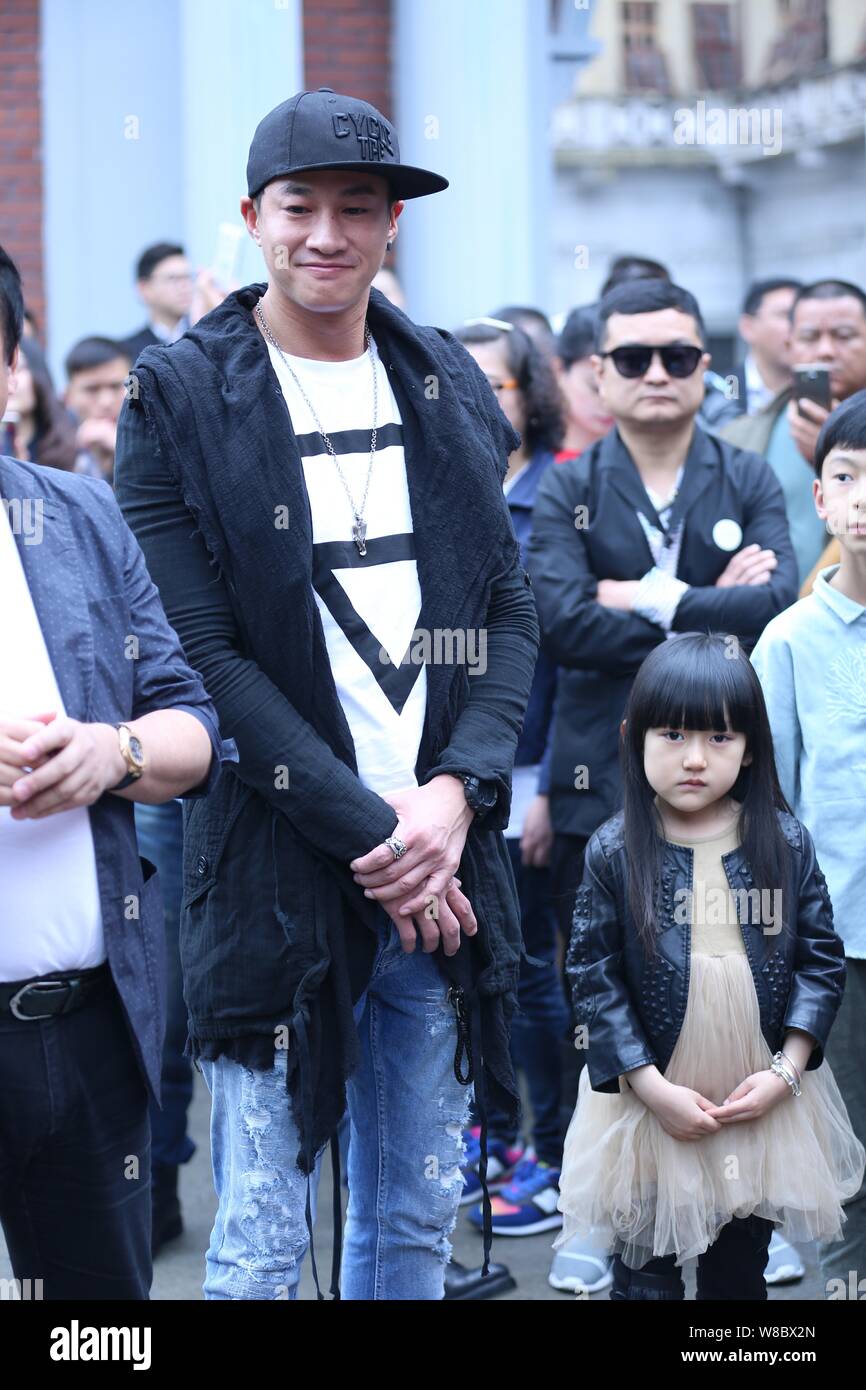 Taiwanese actor Peter Ho, center, attends the opening ceremony for the ...