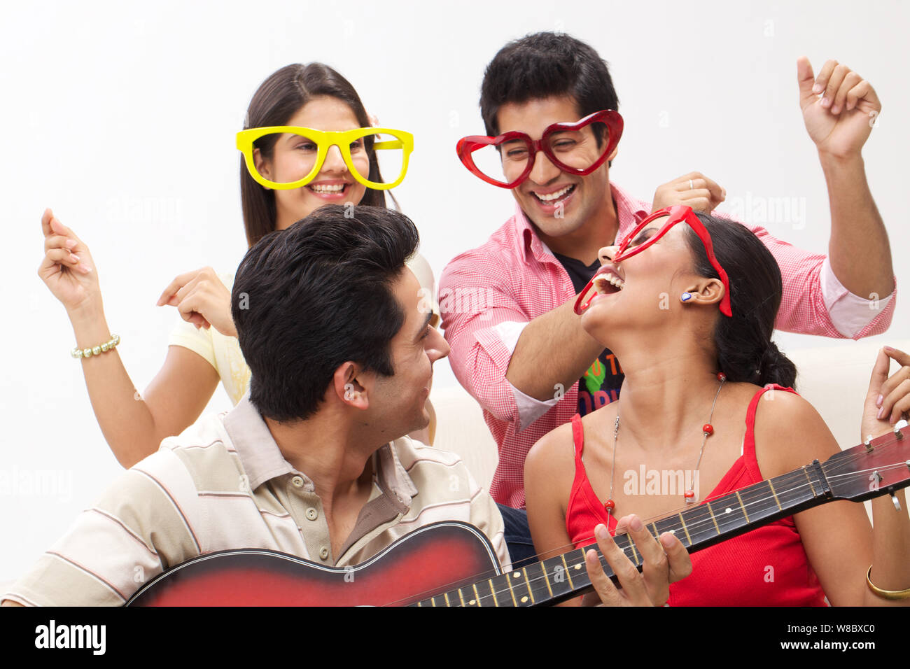 Four friends having fun dancing hi-res stock photography and images - Alamy