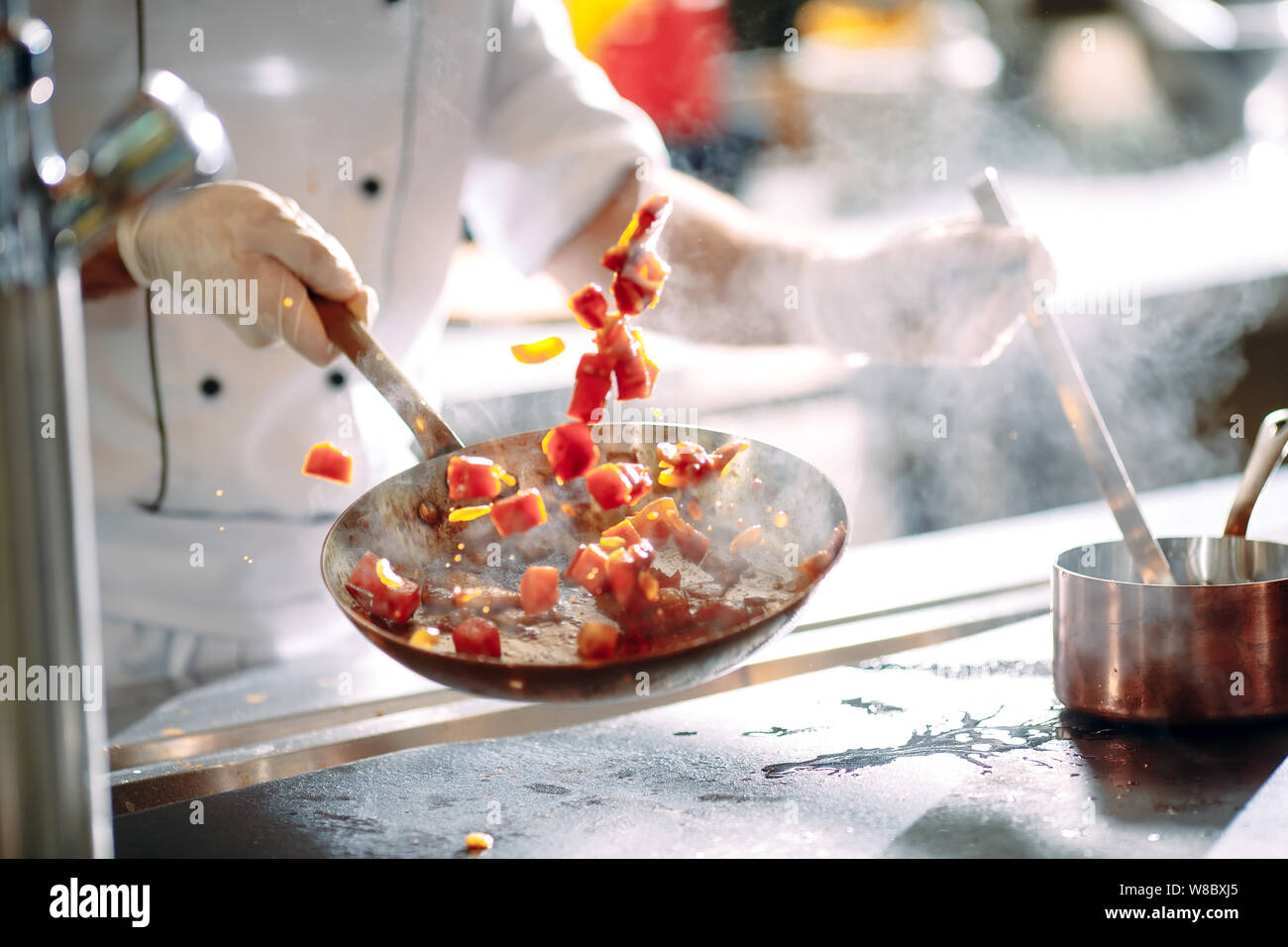 Chef tossing flame hi-res stock photography and images - Alamy