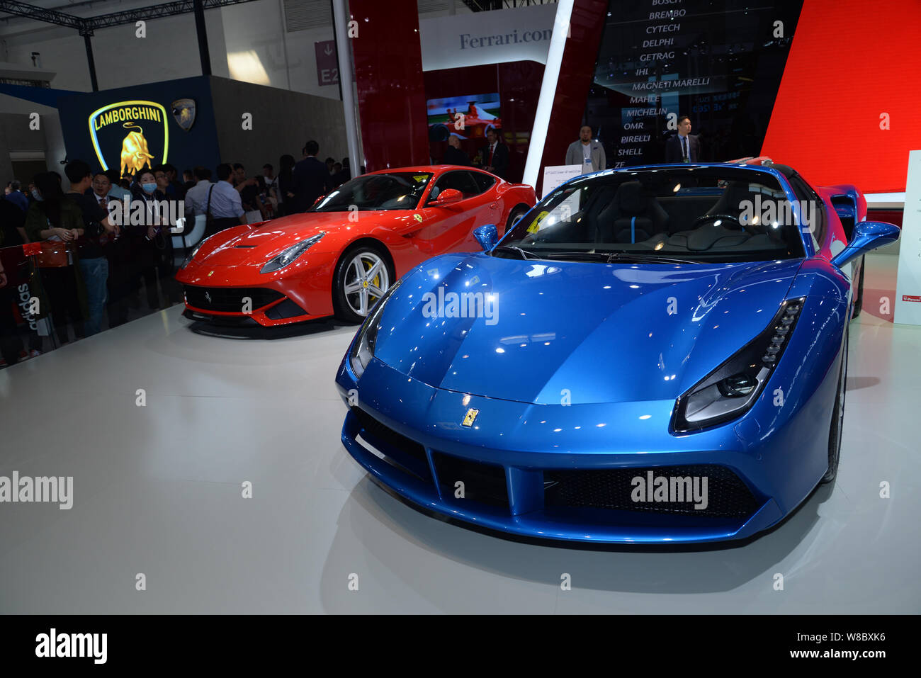 Ferrari 488 GTB, front, and F12 Berlinetta sports cars are on display ...