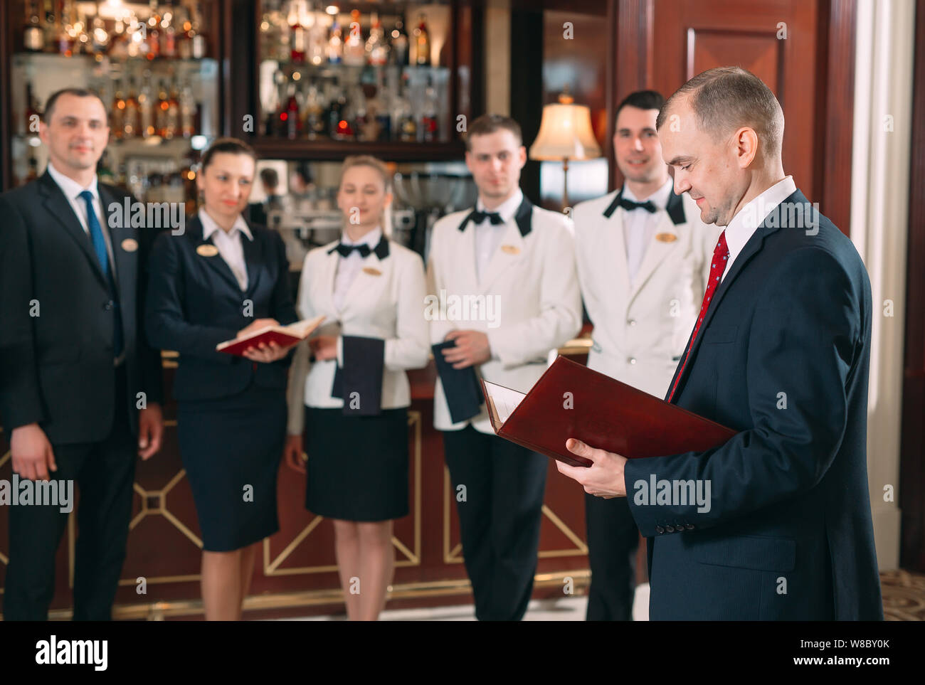 The interaction of the staff. Hotel or restaurant manager and his staff ...