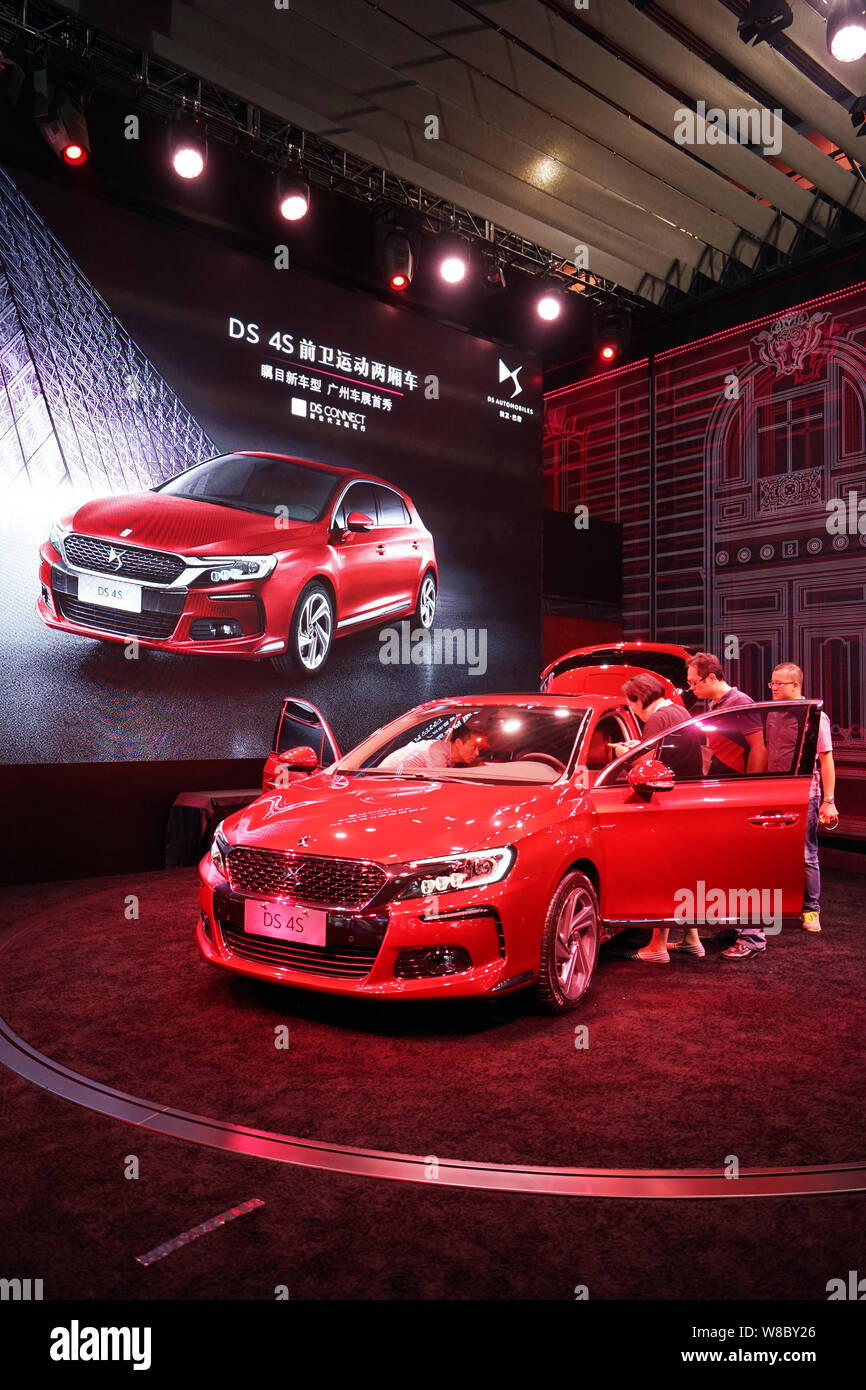 --FILE--Visitors try out a DS 4S of PSA on display during the 13th China (Guangzhou ...