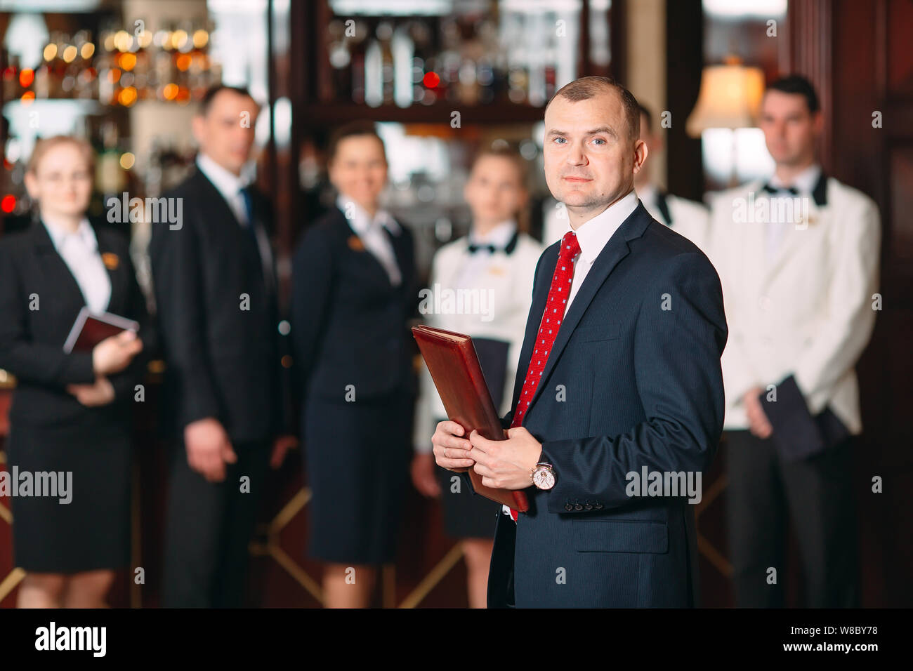 The interaction of the staff. Hotel or restaurant manager and his staff ...