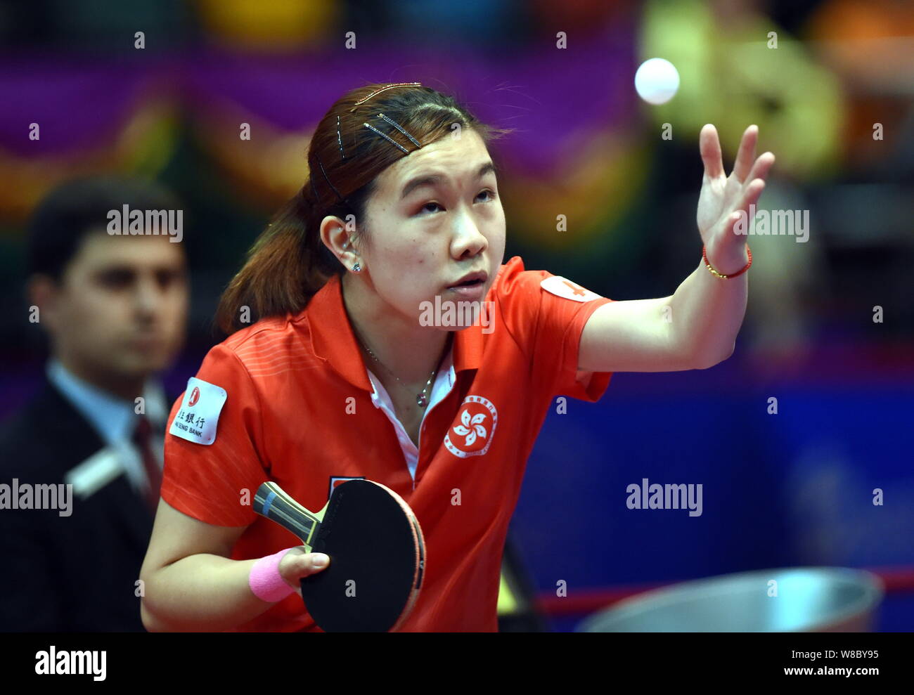 Lee Ho-ching of Hong Kong serves against Kasumi Ishikawa of Japan in ...