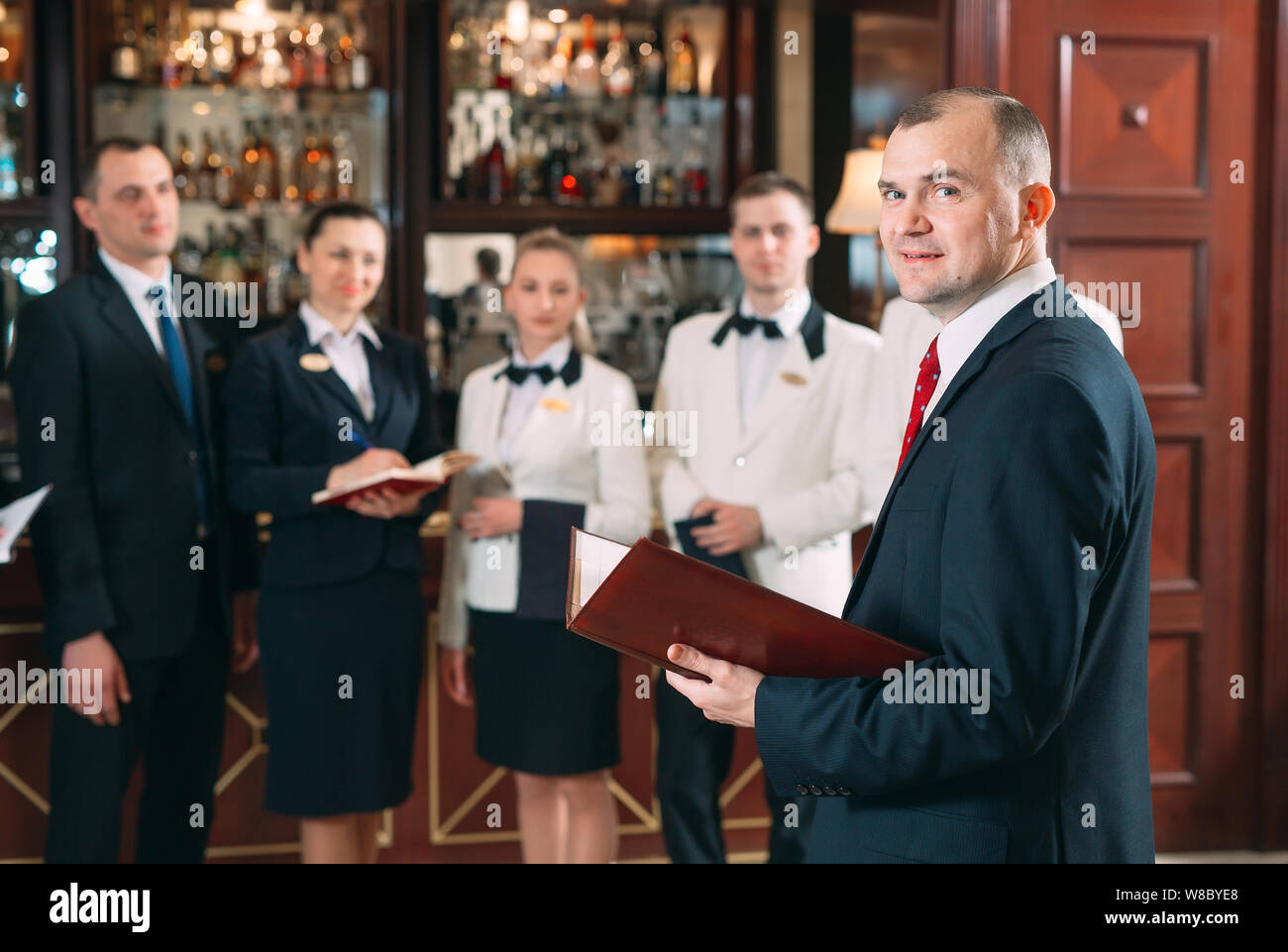 The interaction of the staff. Hotel or restaurant manager and his staff ...