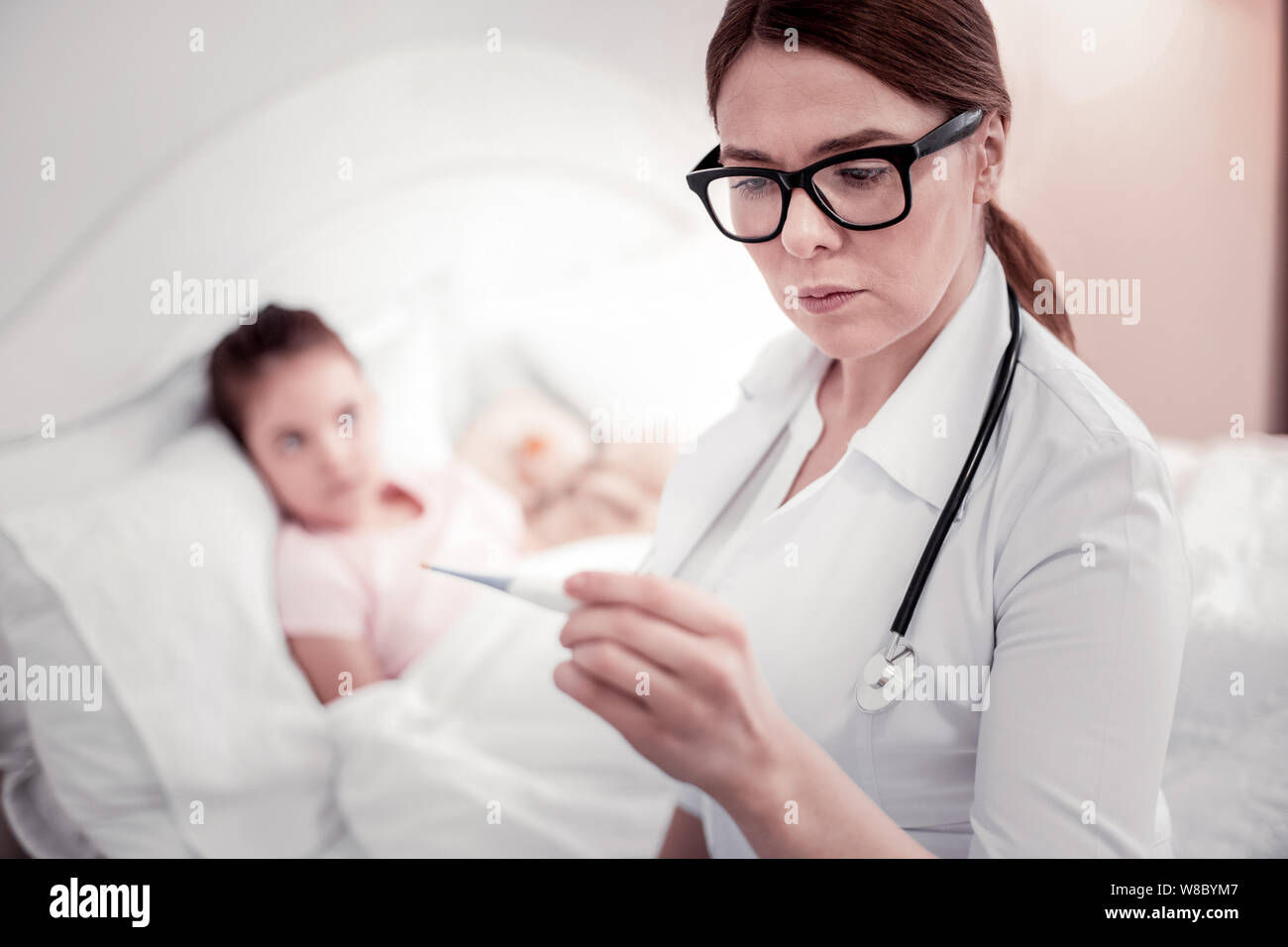 Serious concerned doctor worrying about her patient Stock Photo - Alamy