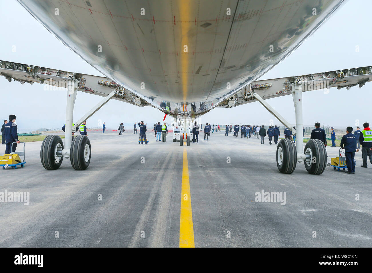 A C919 plane is being towed from the final assembly plant of COMAC ...