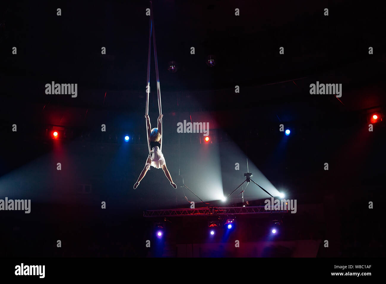 Girl's aerial acrobatics in the Circus ring Stock Photo - Alamy
