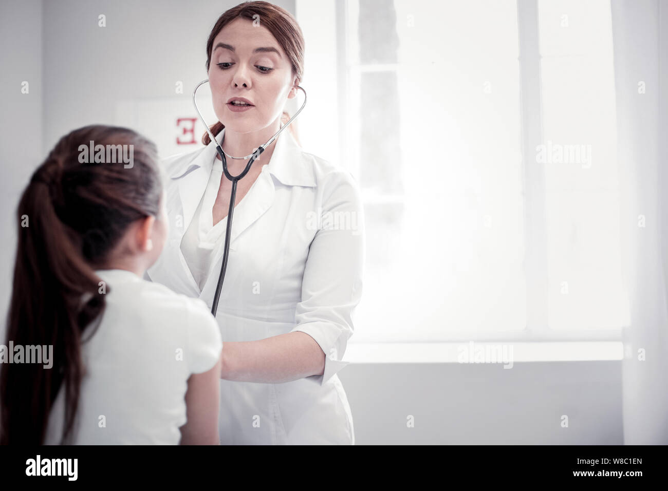 Girl wearing stethoscope hi-res stock photography and images - Alamy