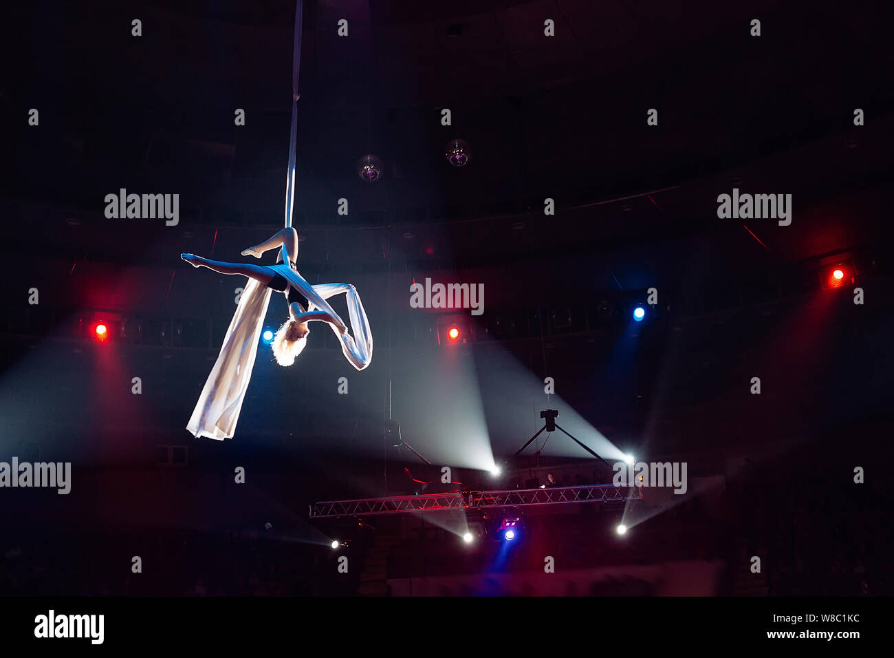 Girl's aerial acrobatics in the Circus ring Stock Photo - Alamy