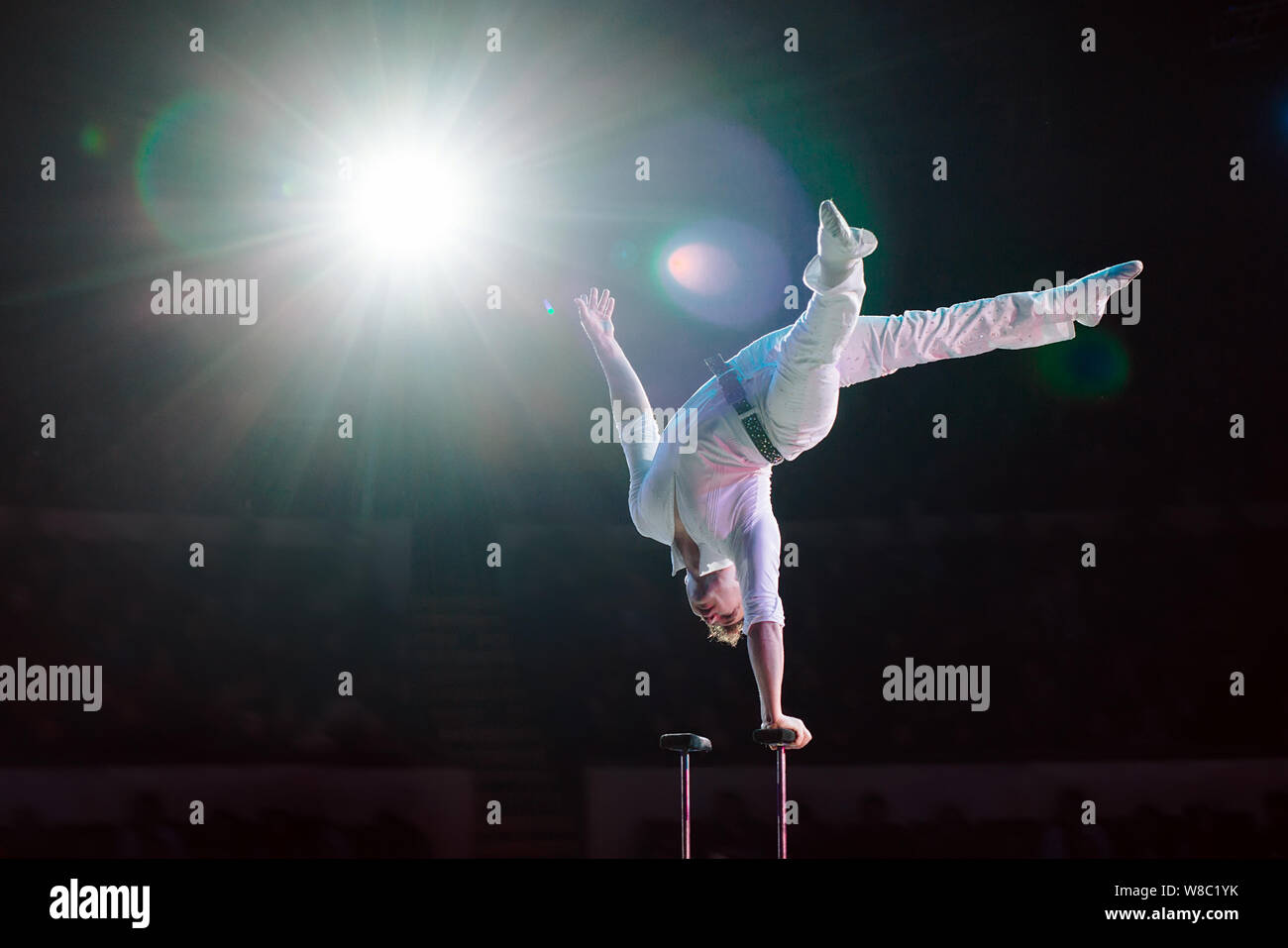Man's aerial acrobatics in the Circus ring Stock Photo - Alamy