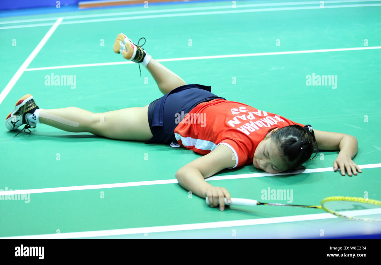 Nozomi Okuhara of Japan reacts after being defeated by Wang Yihan of ...