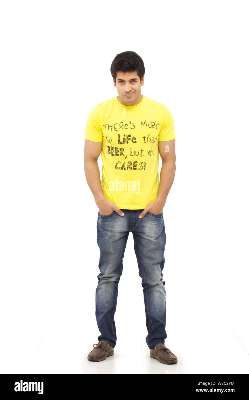 Portrait of a young man standing Stock Photo - Alamy