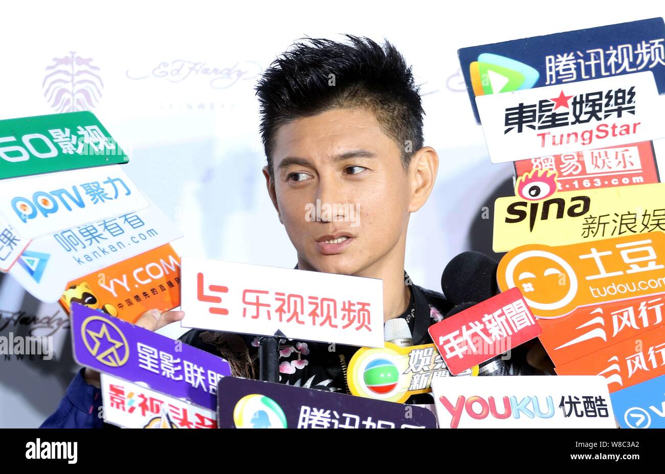 Taiwanese actor Nicky Wu is interviewed as he arrives for a fashion ...