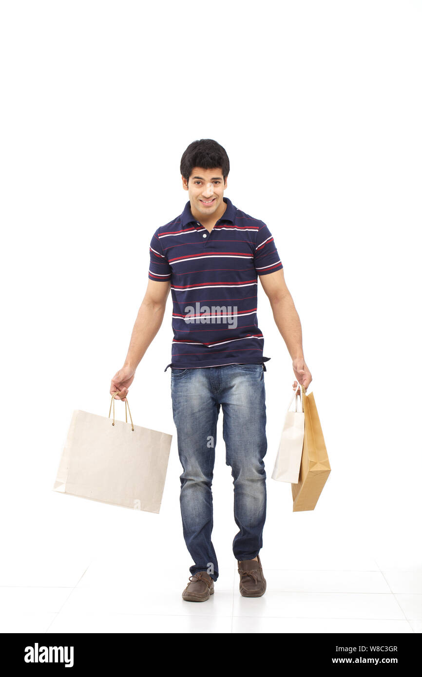 Young man bags isolated Cut Out Stock Images & Pictures - Alamy