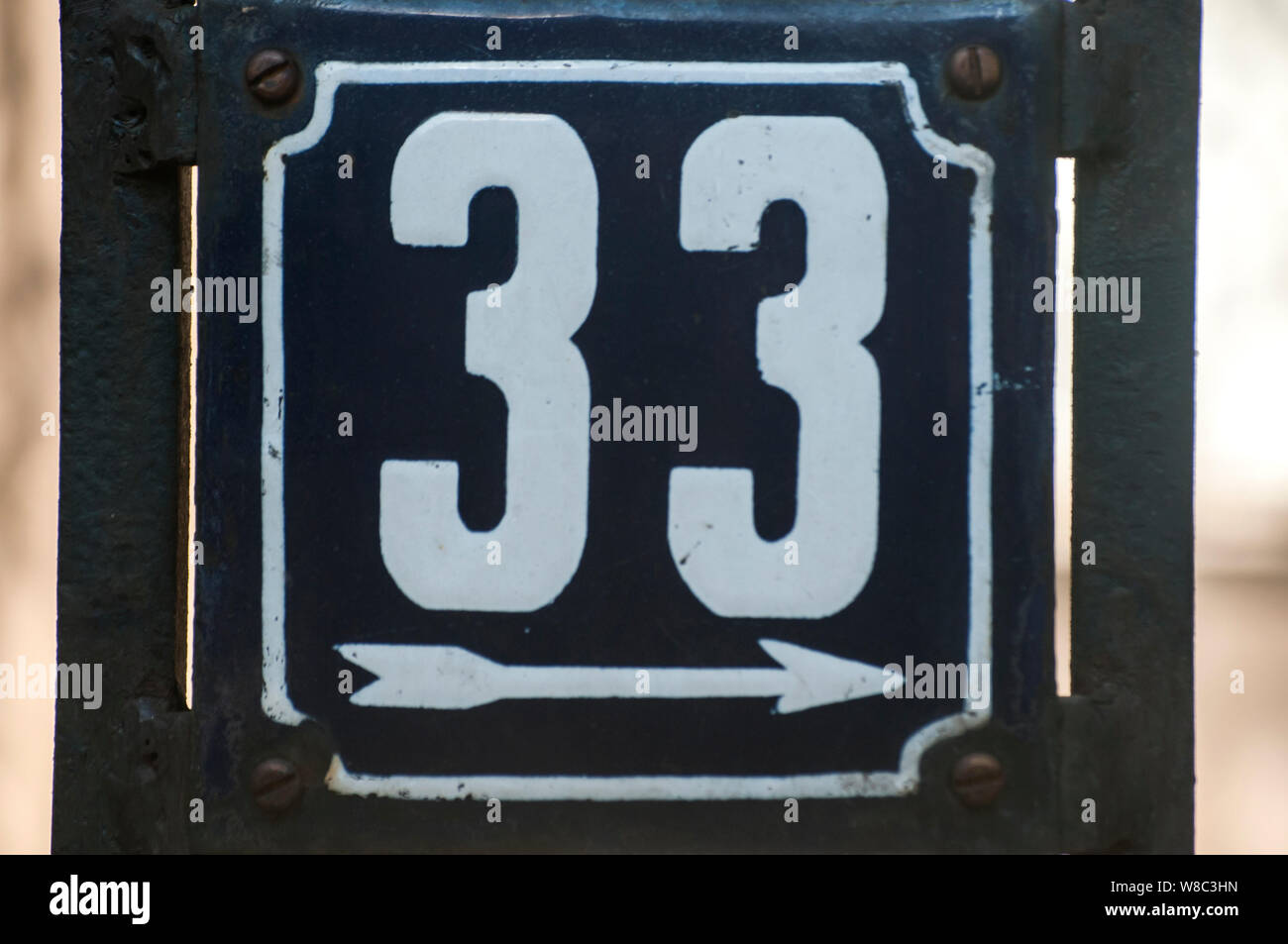 Weathered grunge square metal enameled plate of number of street ...