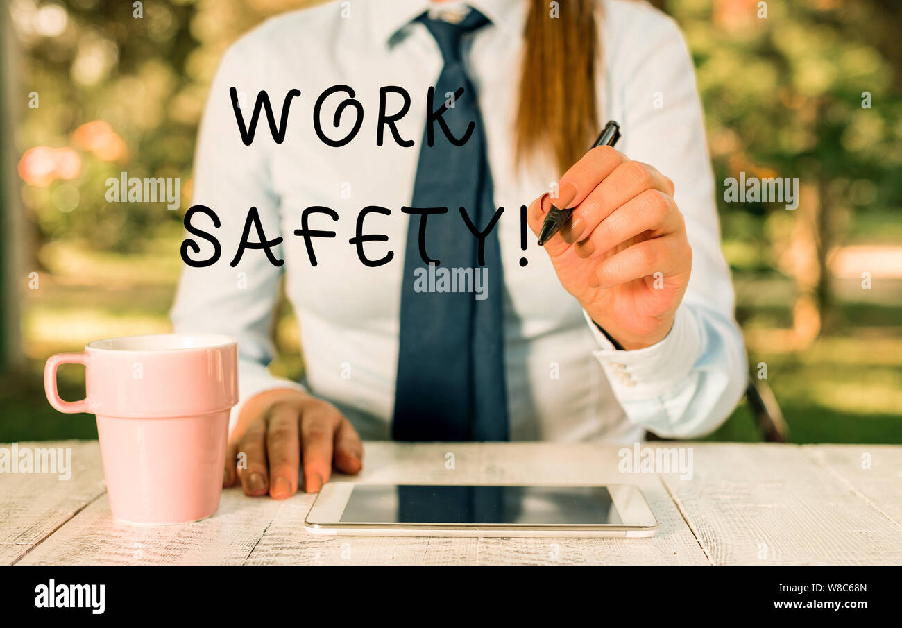 Writing note showing Work Safety. Business concept for policies and ...