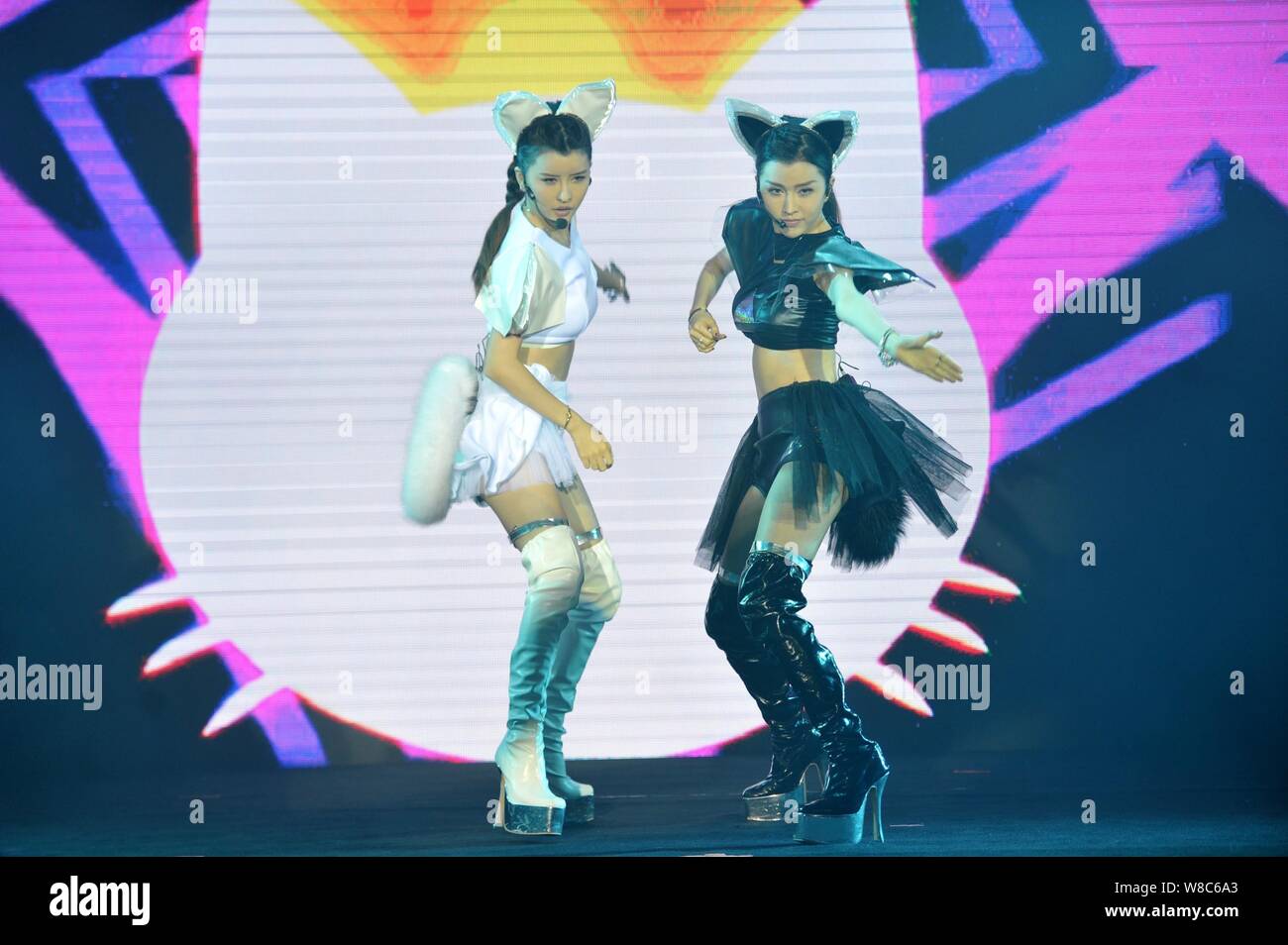 The twin sisters Miko and Yumi of Singaporean girl group BY2 perform at ...