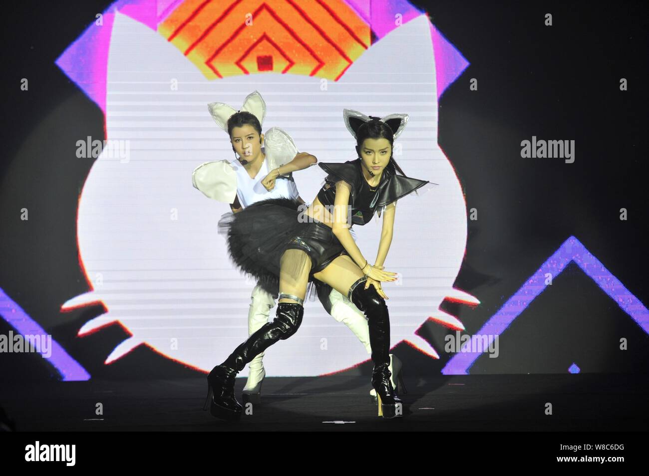 The twin sisters Miko and Yumi of Singaporean girl group BY2 perform at ...