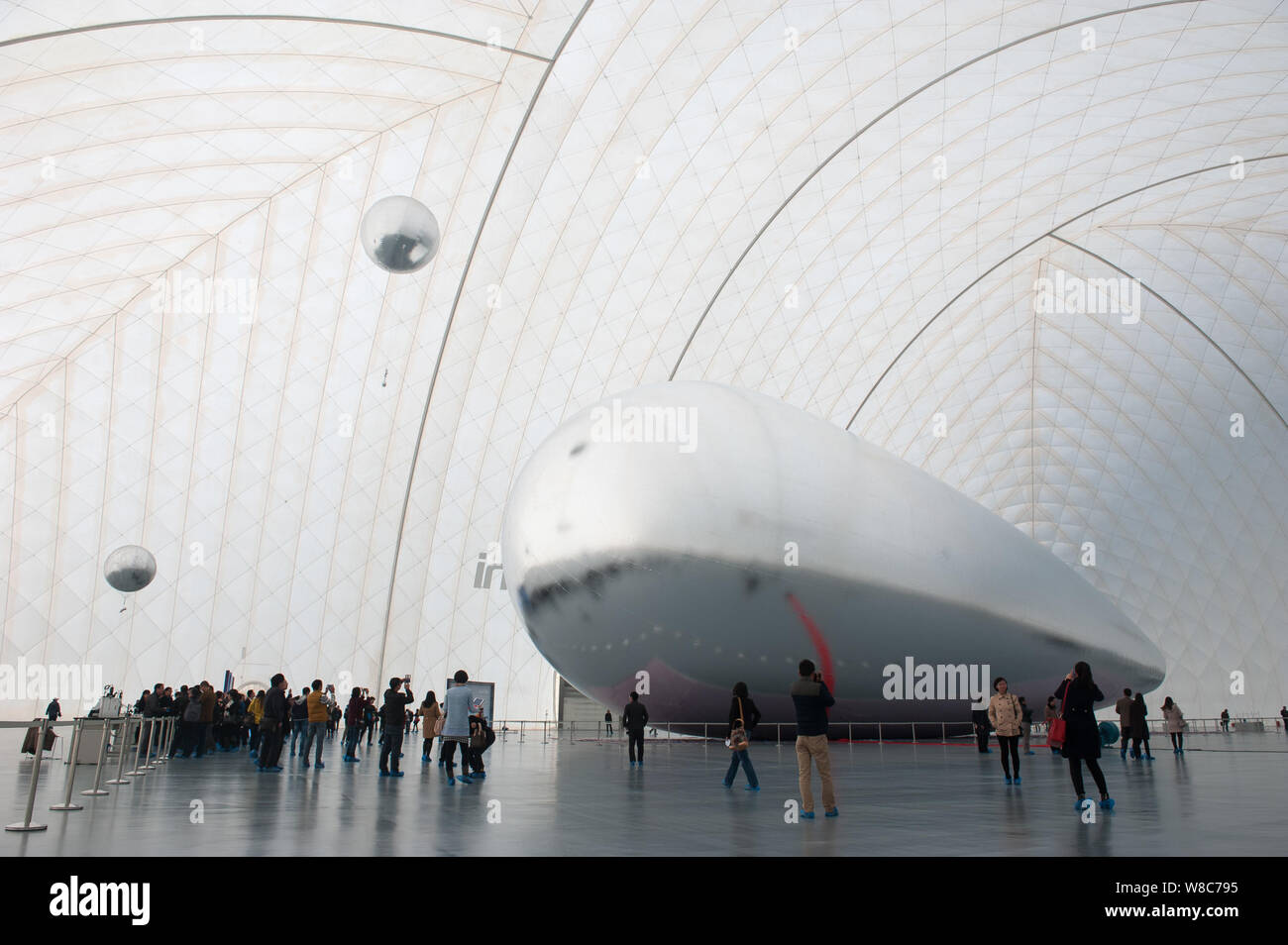 --FILE--Visitors look at the flying platform "Cloud" on display at the ...