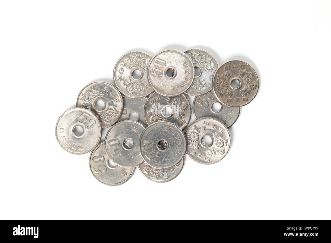 Pile of 50 yen coins japanese money, close up on white background Stock ...