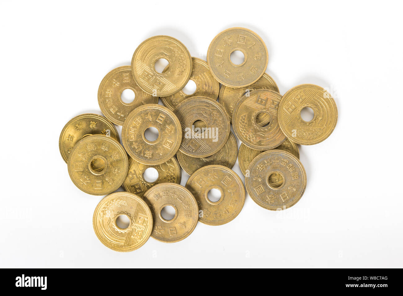 Pile of 5 yen coins japanese money, close up on white background Stock ...