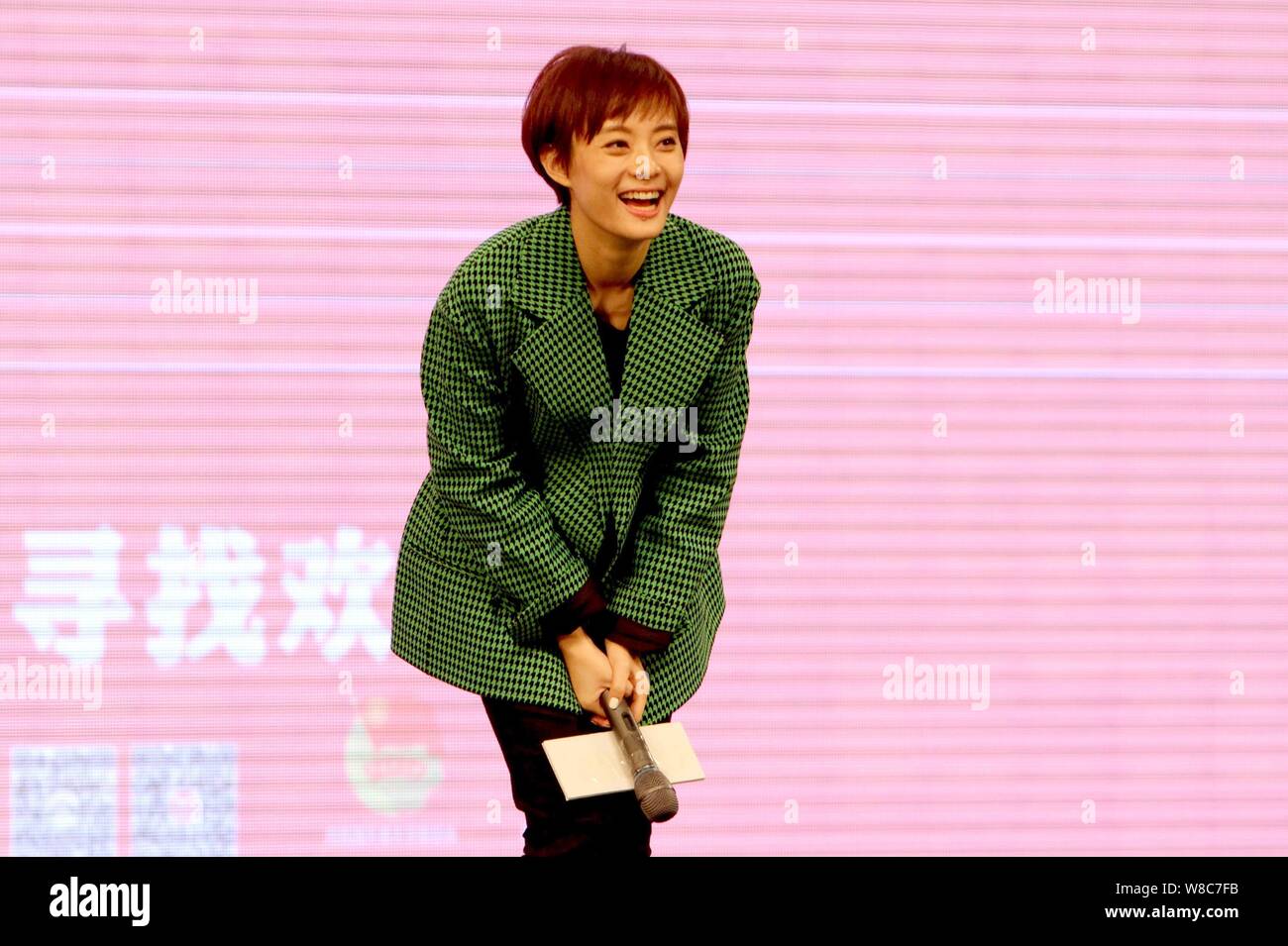 Chinese actress Sun Li reacts during a public event to promote her new ...