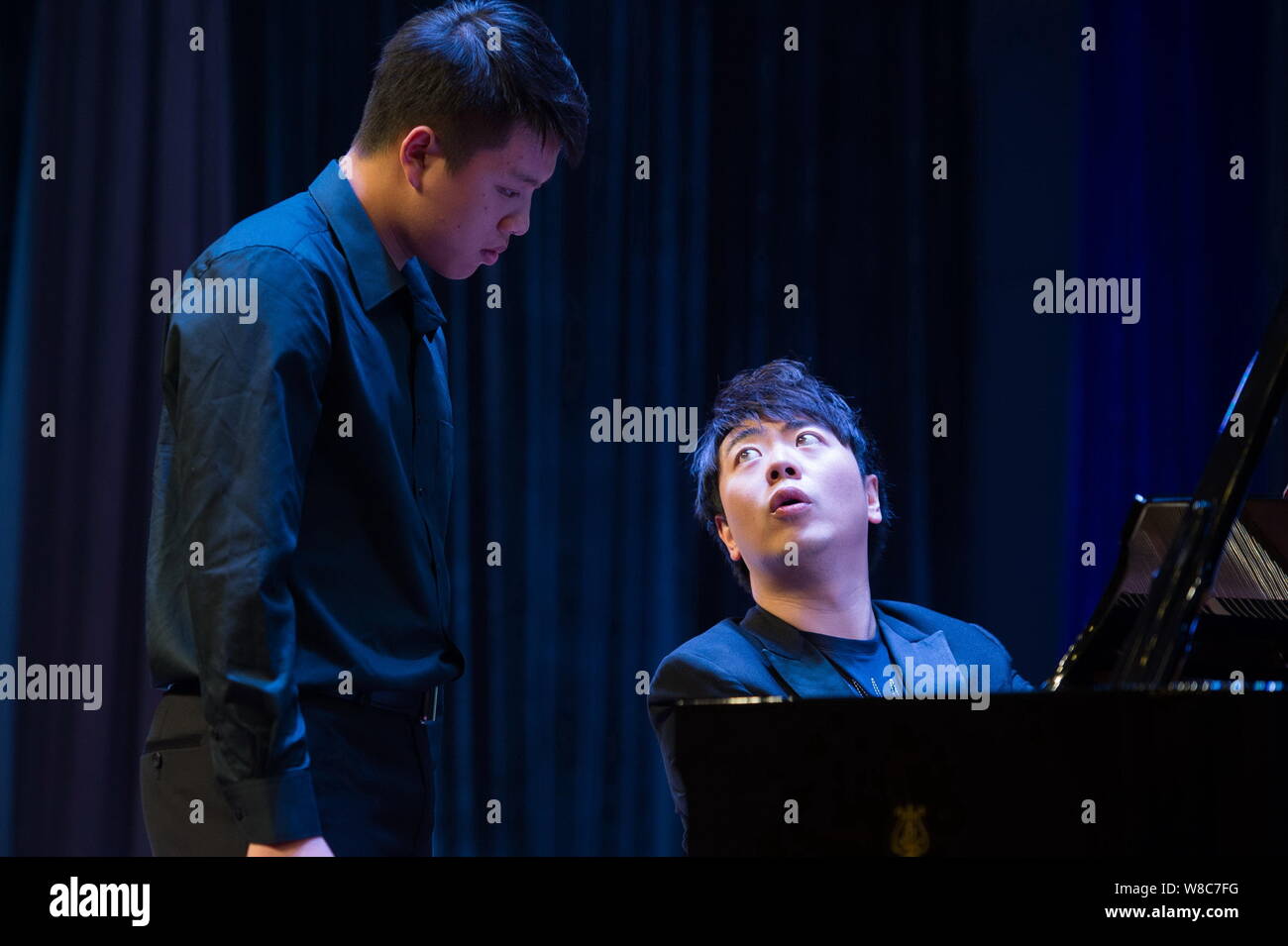 Chinese pianist Lang Lang attends a piano class for university students ...