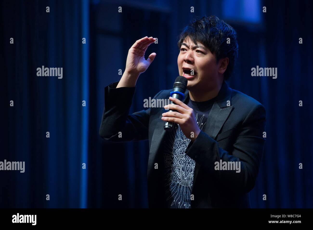 Chinese pianist Lang Lang attends a piano class for university students ...